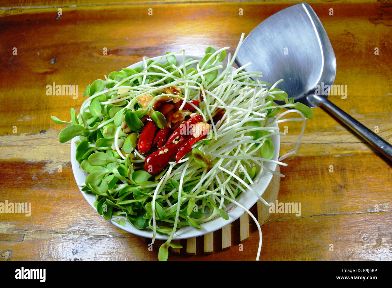 raw sunflower sprout and iron flipper prepare to cook Stock Photo - Alamy