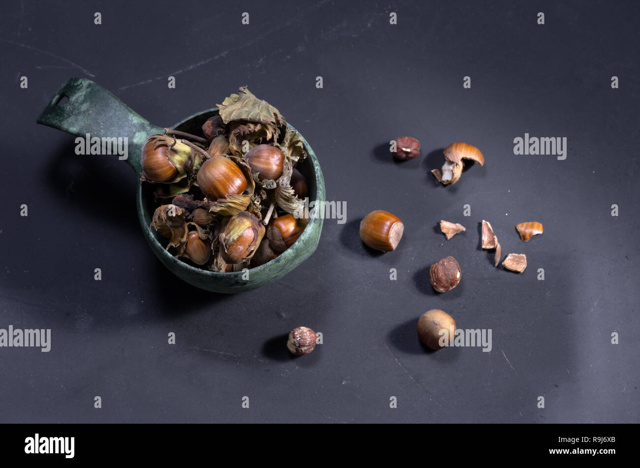 A bowl full of nuts. Unusual bowl with nuts. Top view Stock Photo - Alamy