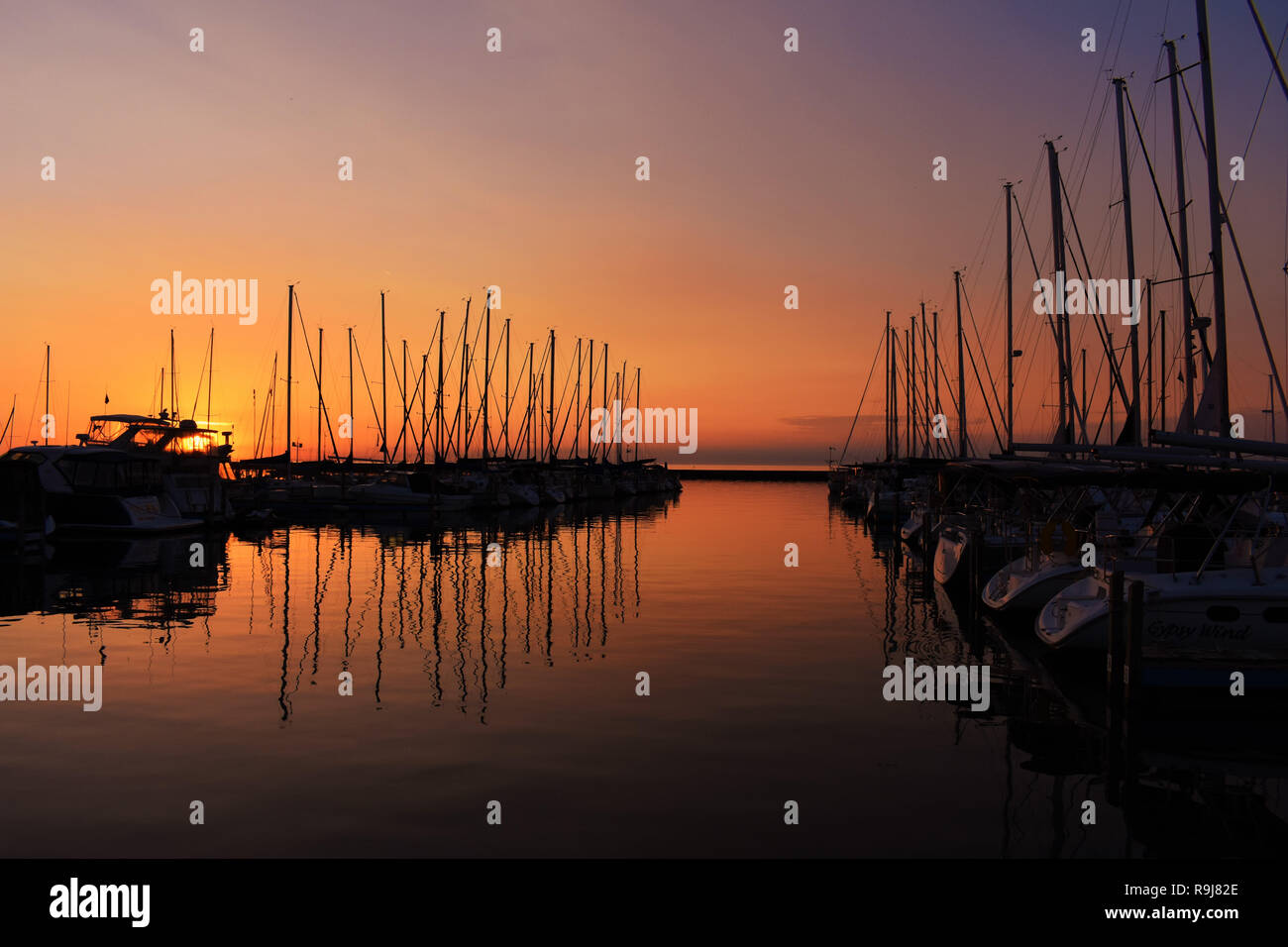 Sun rising over boats in harbour at Port Sanilac, Michigan Stock Photo ...
