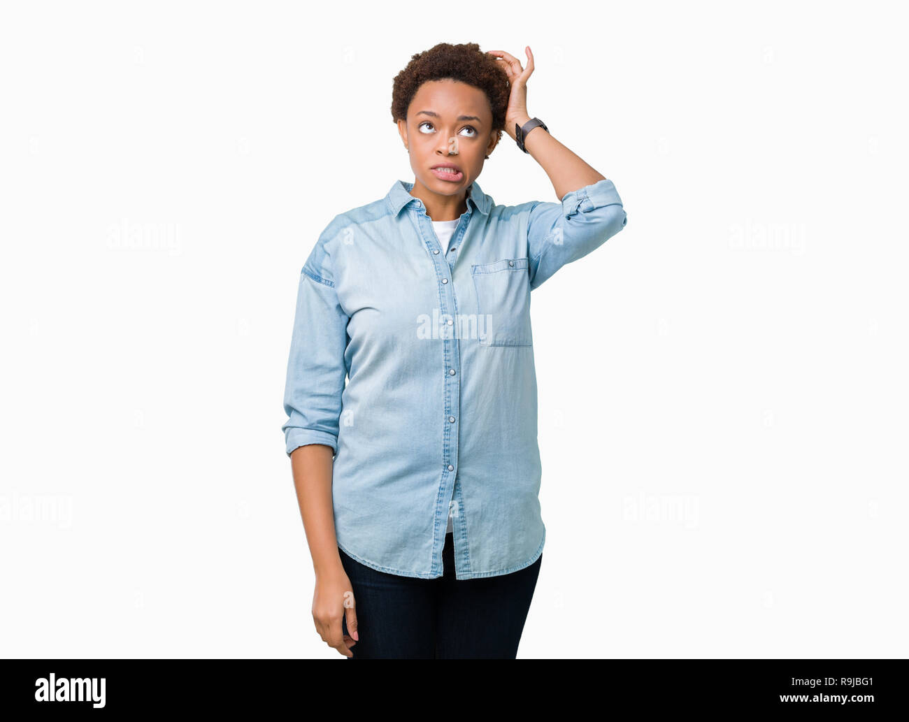 Young beautiful african american woman over isolated background confuse ...