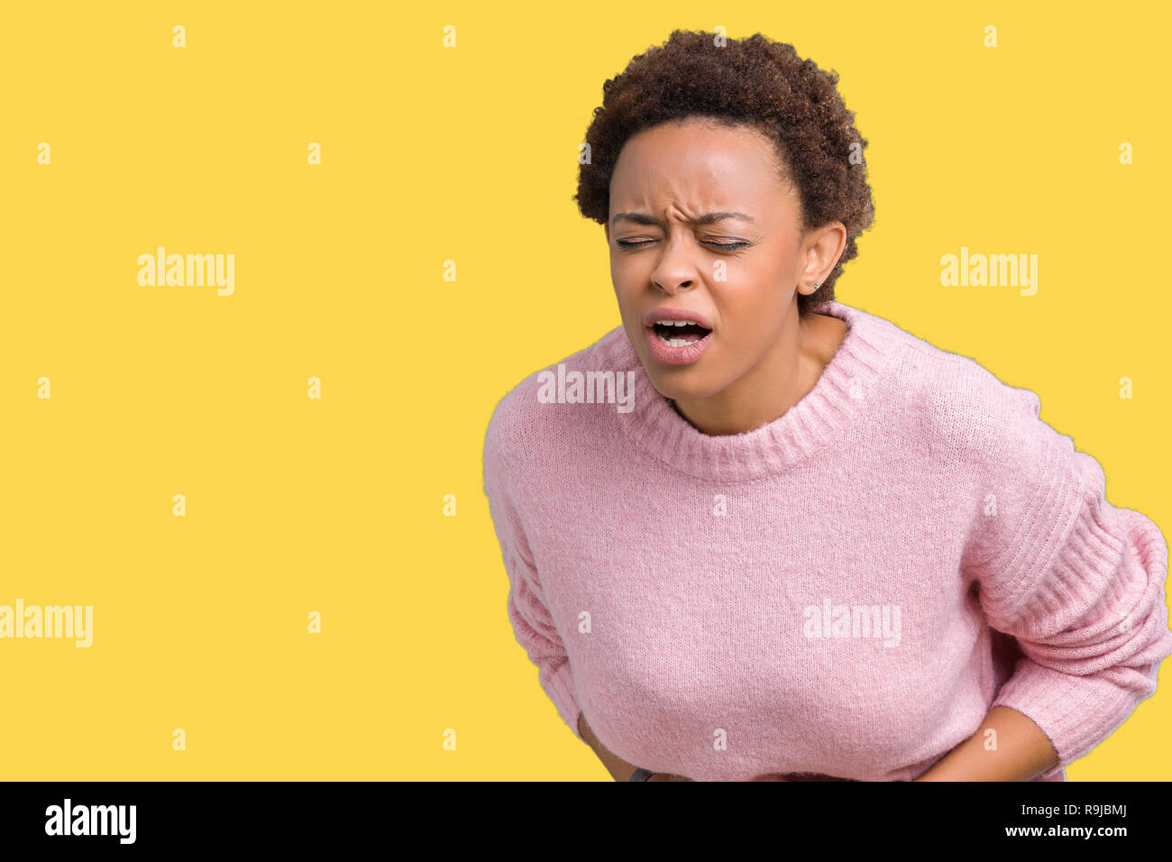 Beautiful young african american woman over isolated background with ...