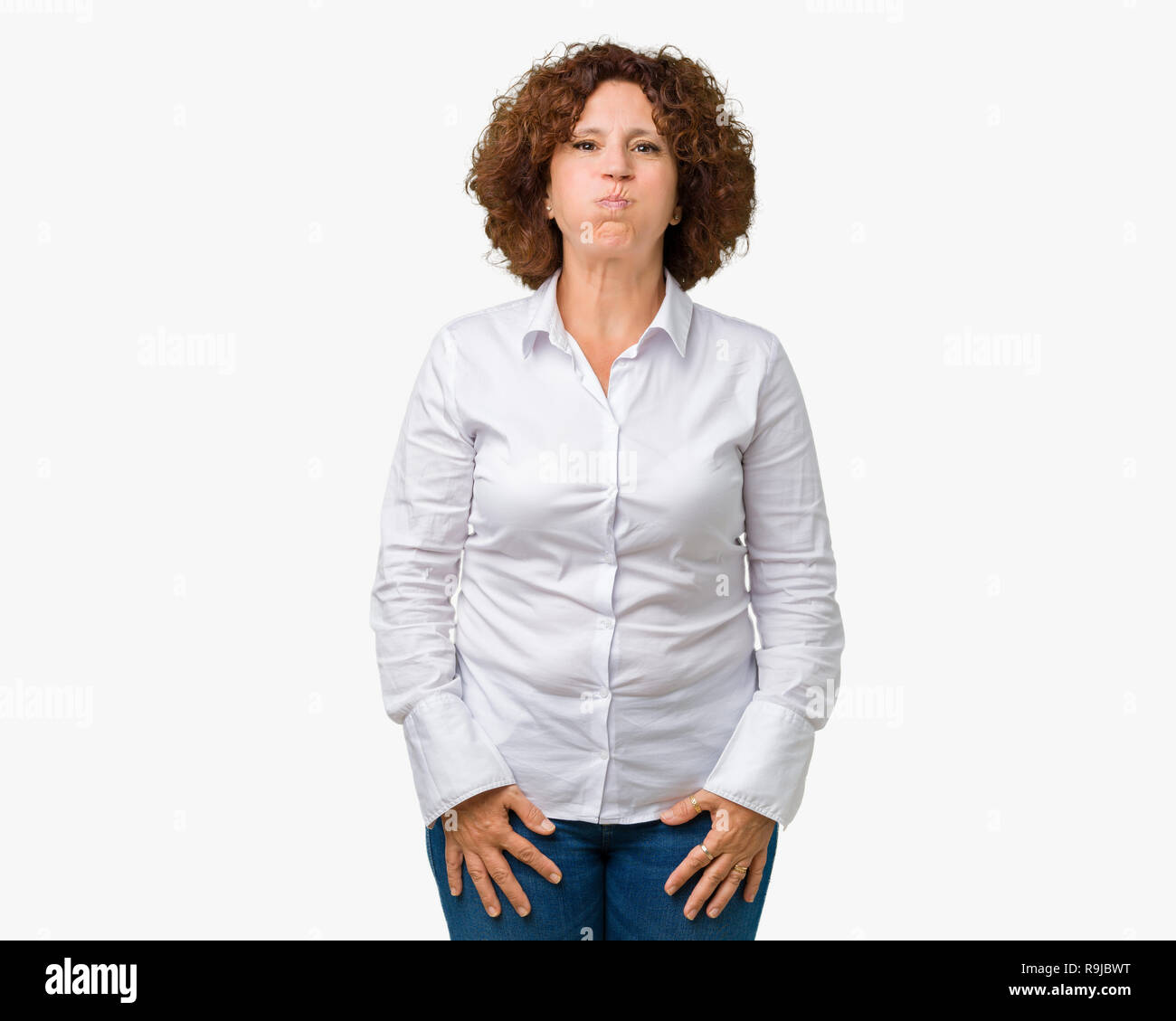 Beautiful middle ager senior businees woman over isolated background ...