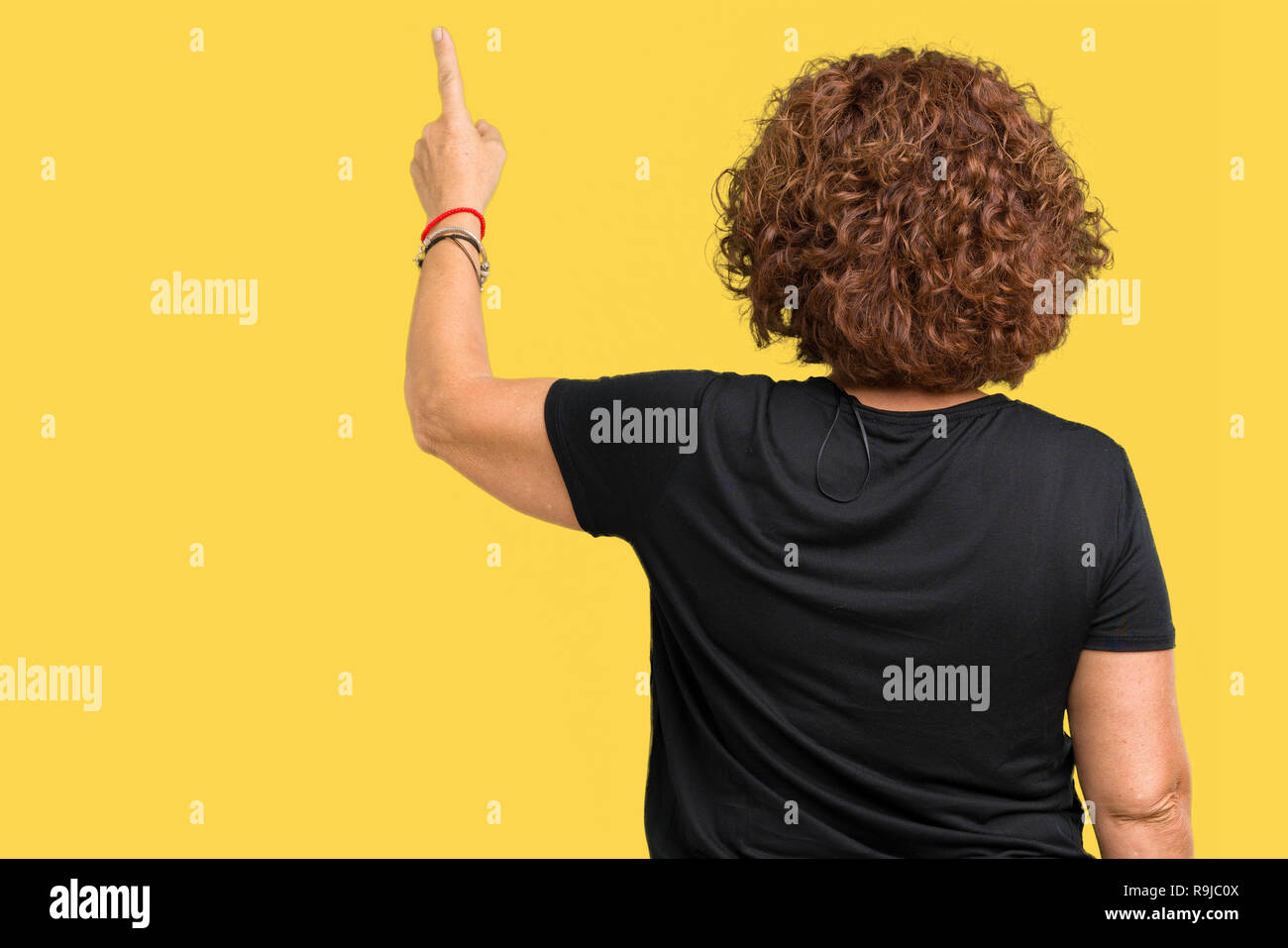 Beautiful middle ager senior woman over isolated background Posing ...