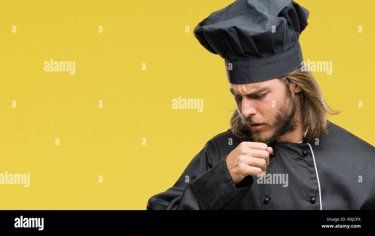 Young handsome cook man with long hair over isolated background feeling ...