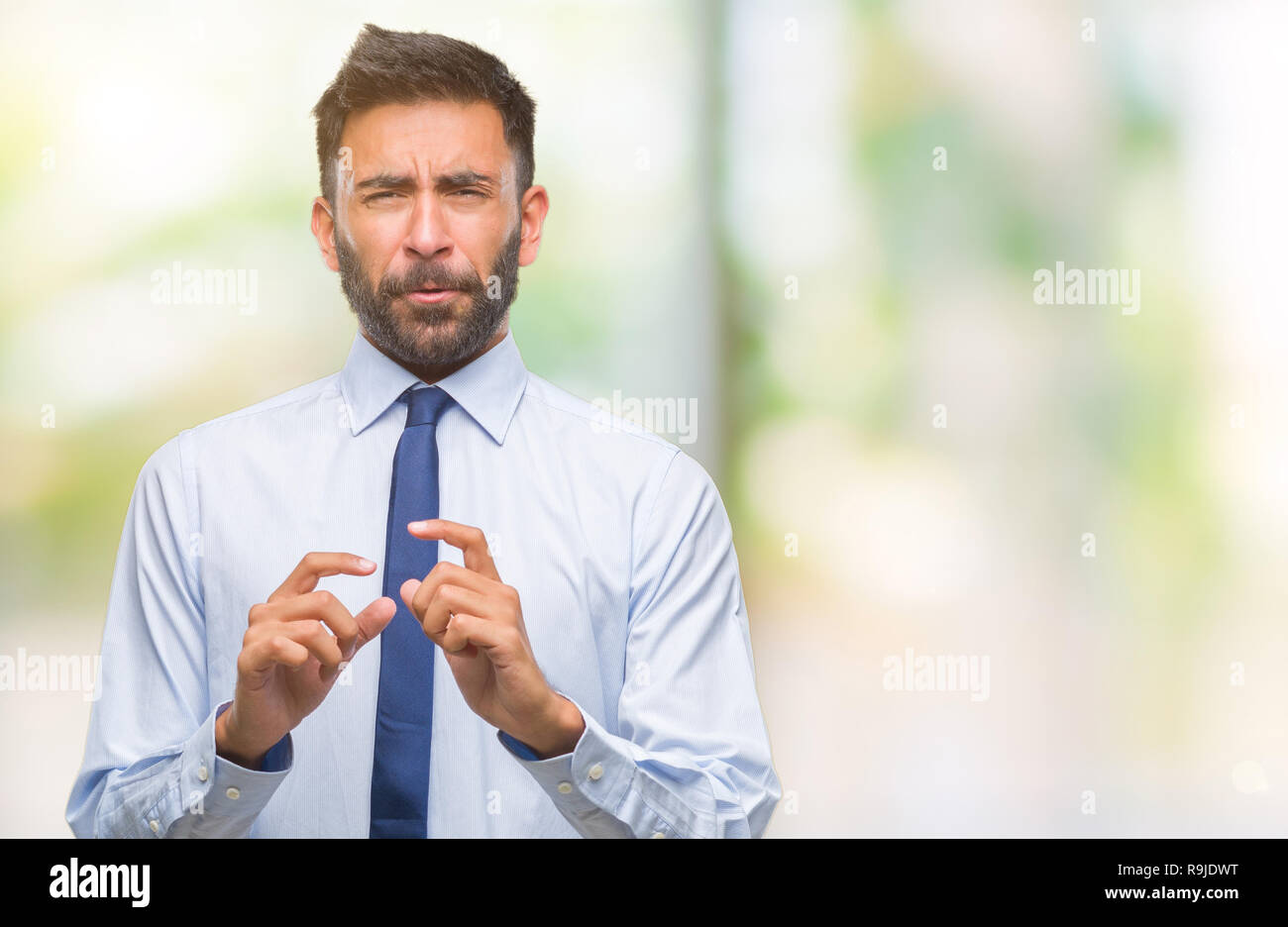Adult hispanic business man over isolated background disgusted ...