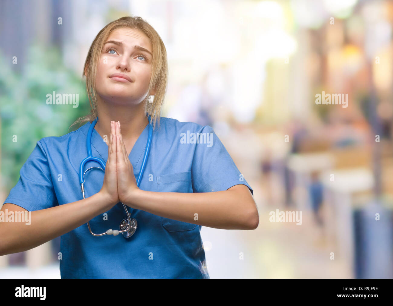 Young caucasian doctor woman wearing surgeon uniform over isolated ...