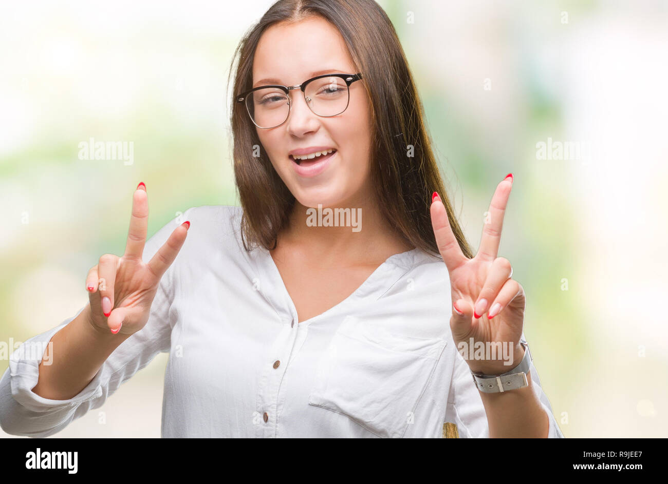 Young caucasian beautiful business woman wearing glasses over isolated ...