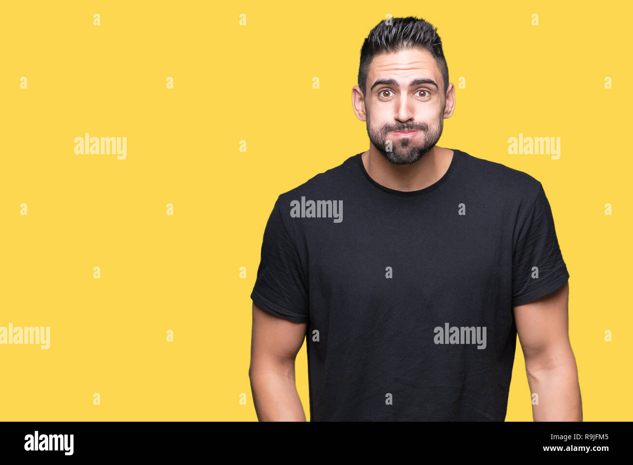 Young handsome man over isolated background puffing cheeks with funny ...