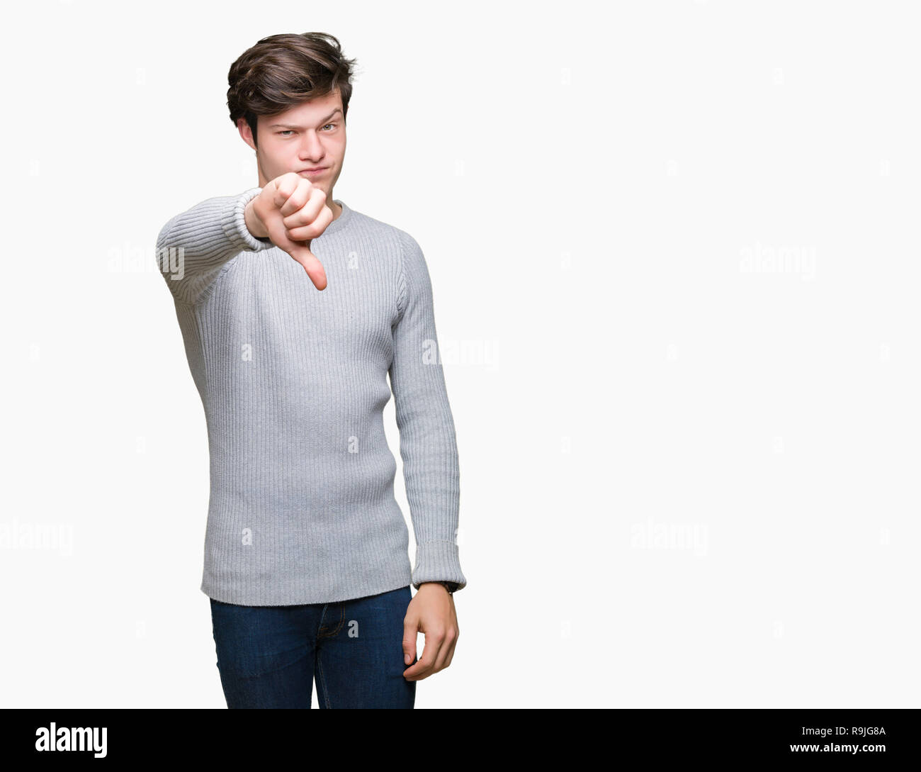 Young handsome man wearing winter sweater over isolated background ...