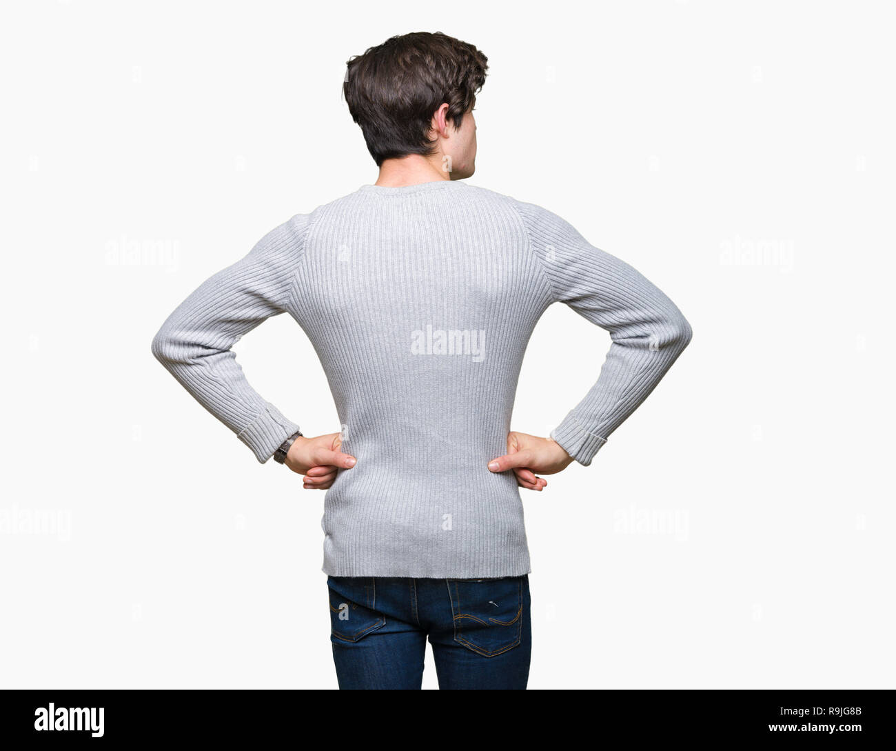 Young handsome man wearing winter sweater over isolated background ...