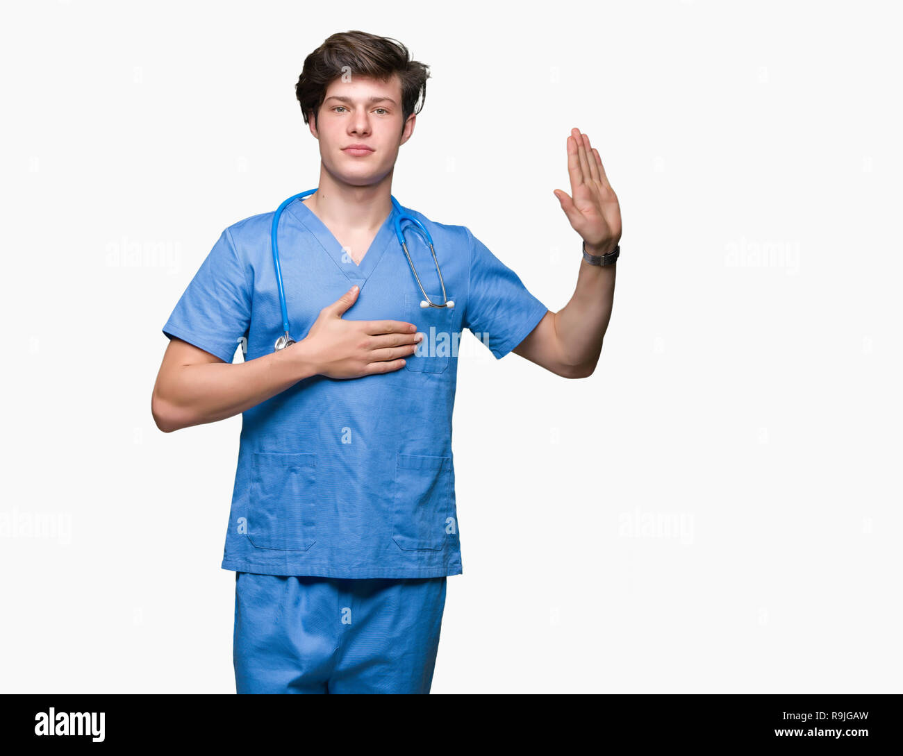 Young doctor wearing medical uniform over isolated background Swearing ...