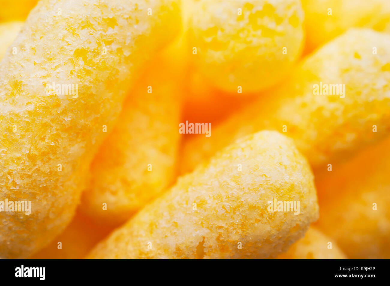 Closeup Image of Yellow Corn Puffs. Crunchy Flavored Puffed Snacks ...