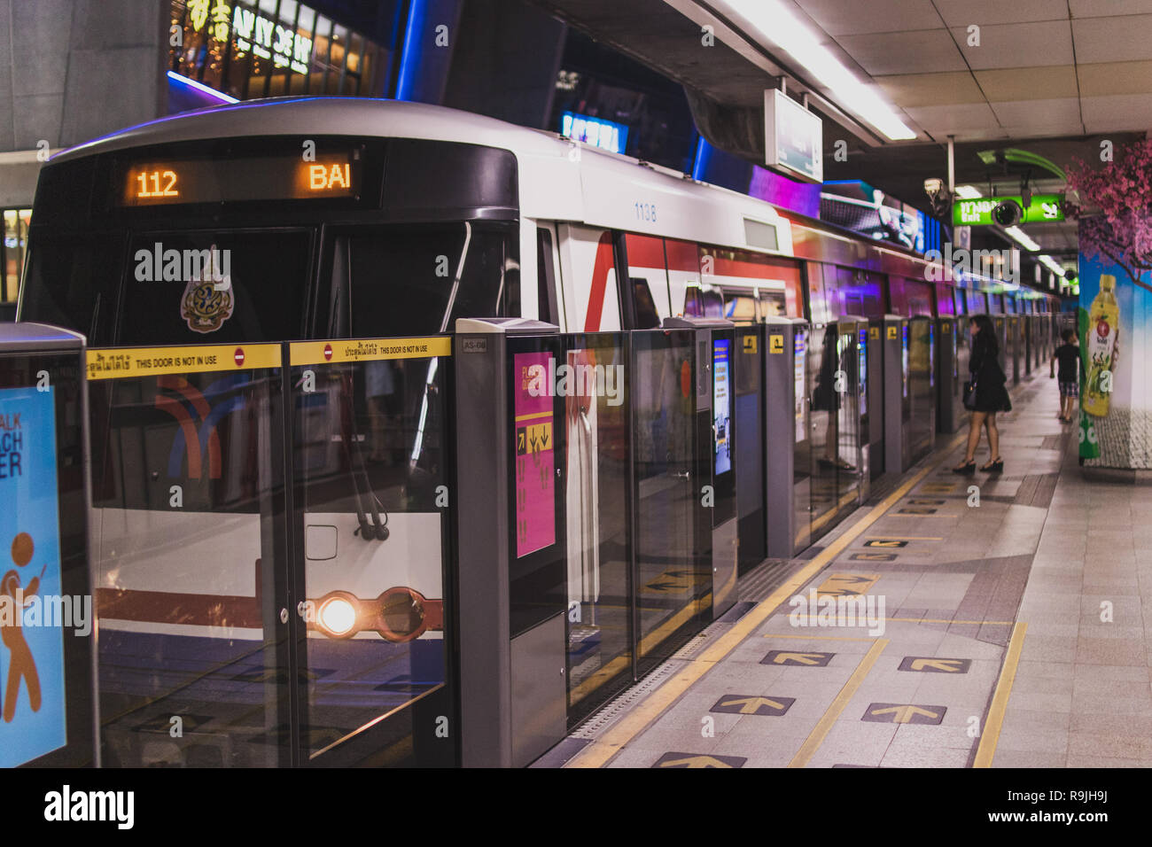 BTS Skytrain arriving at Siam station bound for Bang Wa station with a ...