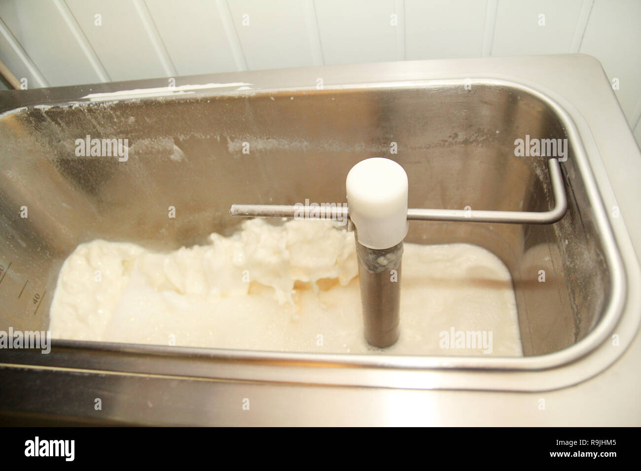 Ice cream making process at ice cream factory, milk and cooking mixing ...
