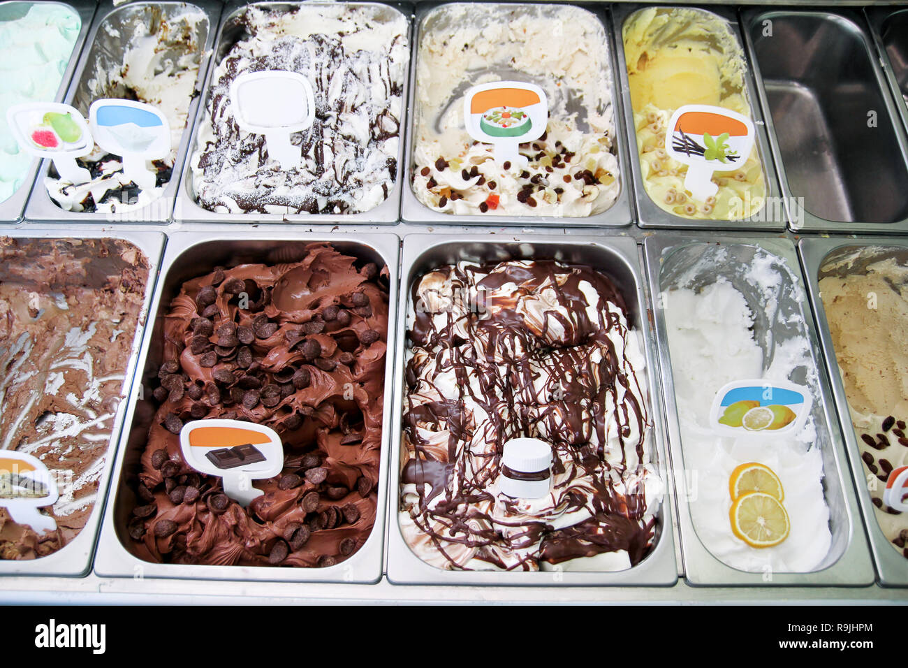 Ice cream fridge with creamy and fruit Italian ice cream steel serving ...
