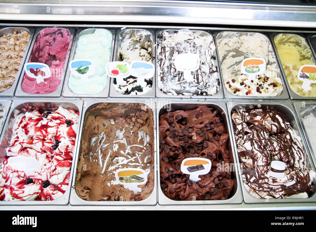 Ice cream fridge with creamy and fruit Italian ice cream steel serving ...