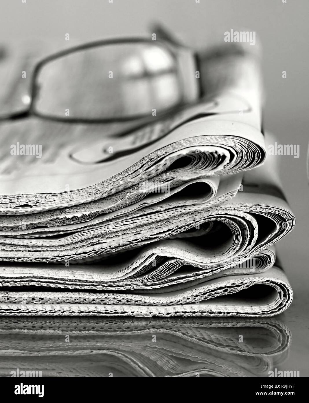 Pile of newspapers in white background hi-res stock photography and ...