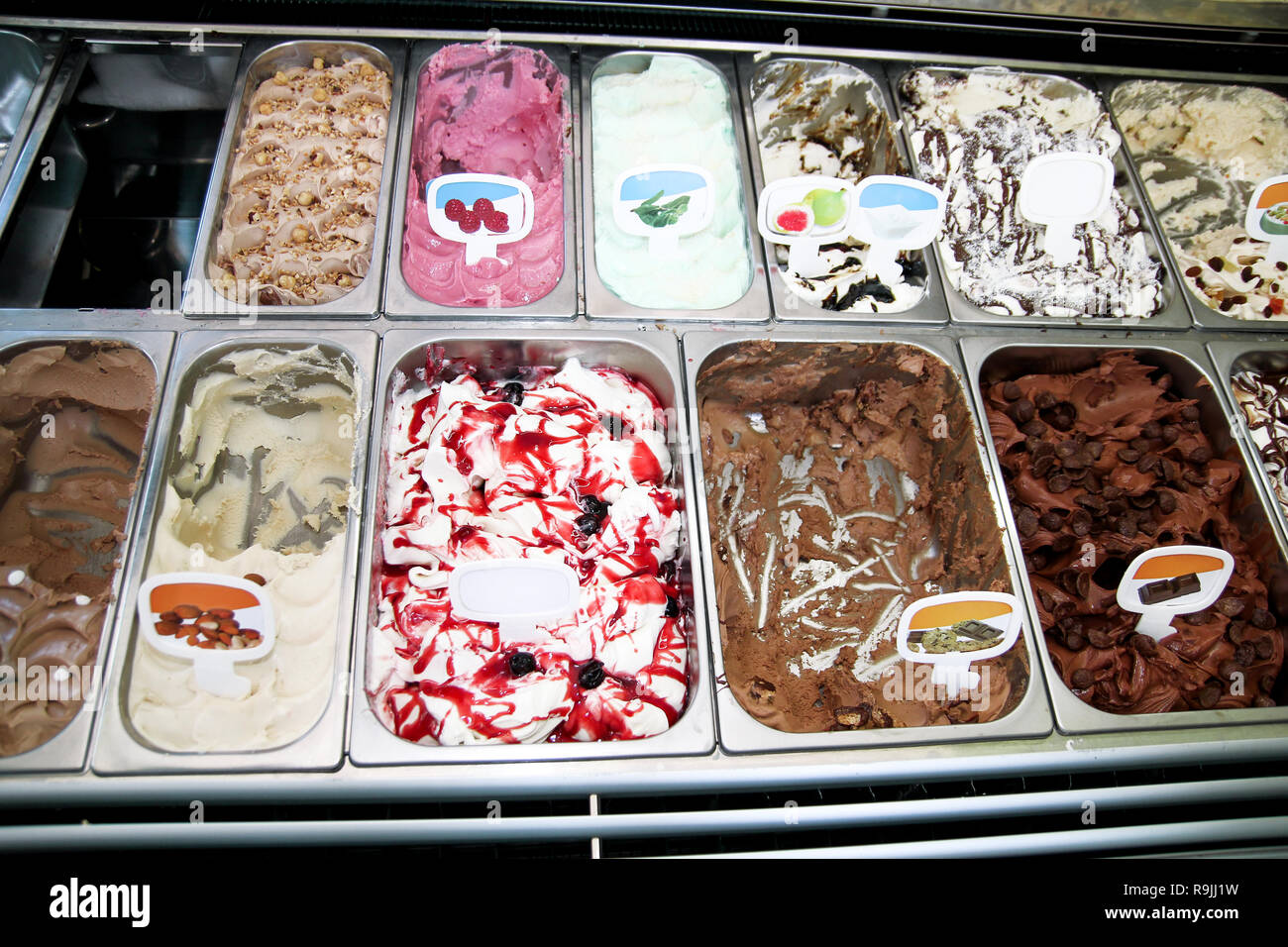 Ice cream fridge with creamy and fruit Italian ice cream steel serving ...