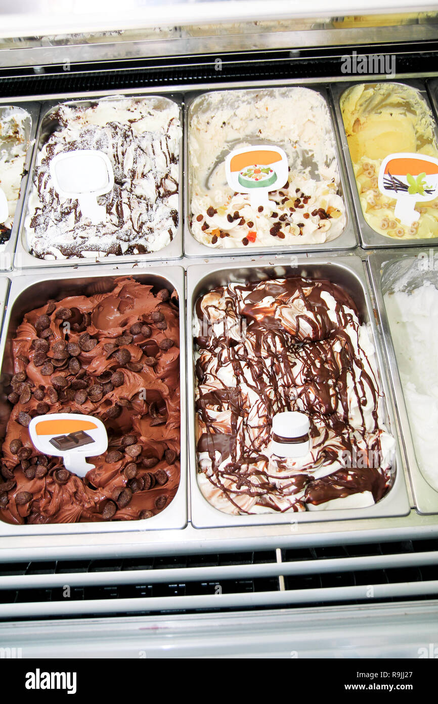 Ice cream fridge with creamy and fruit Italian ice cream steel serving ...