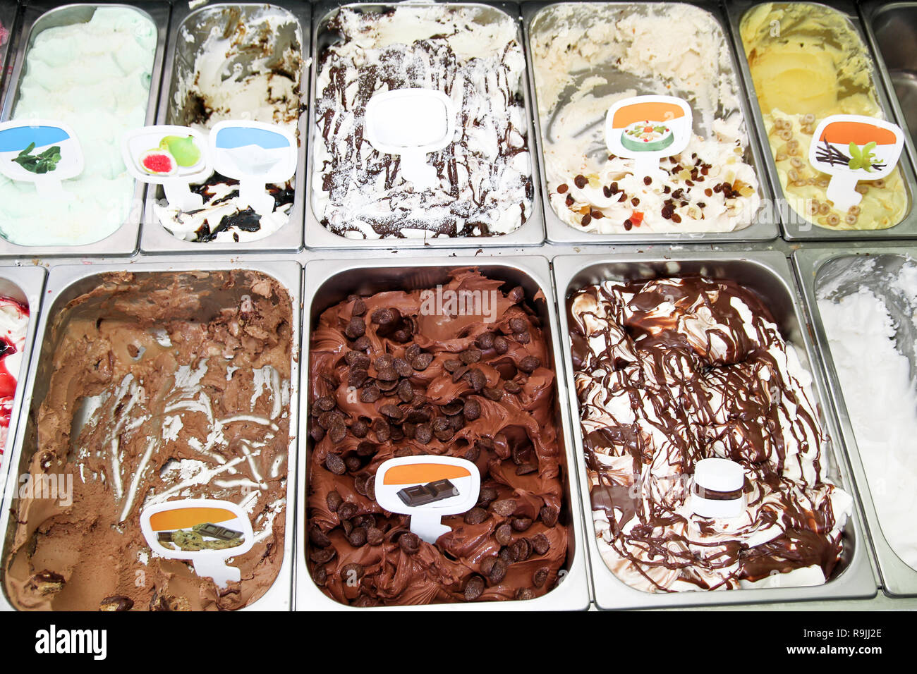 Ice cream fridge with creamy and fruit Italian ice cream steel serving ...