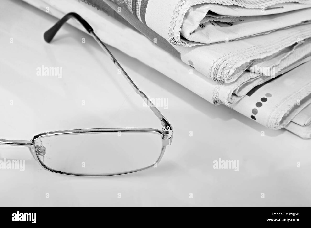 newspaper piled up on a table in a office no people stock photo Stock ...