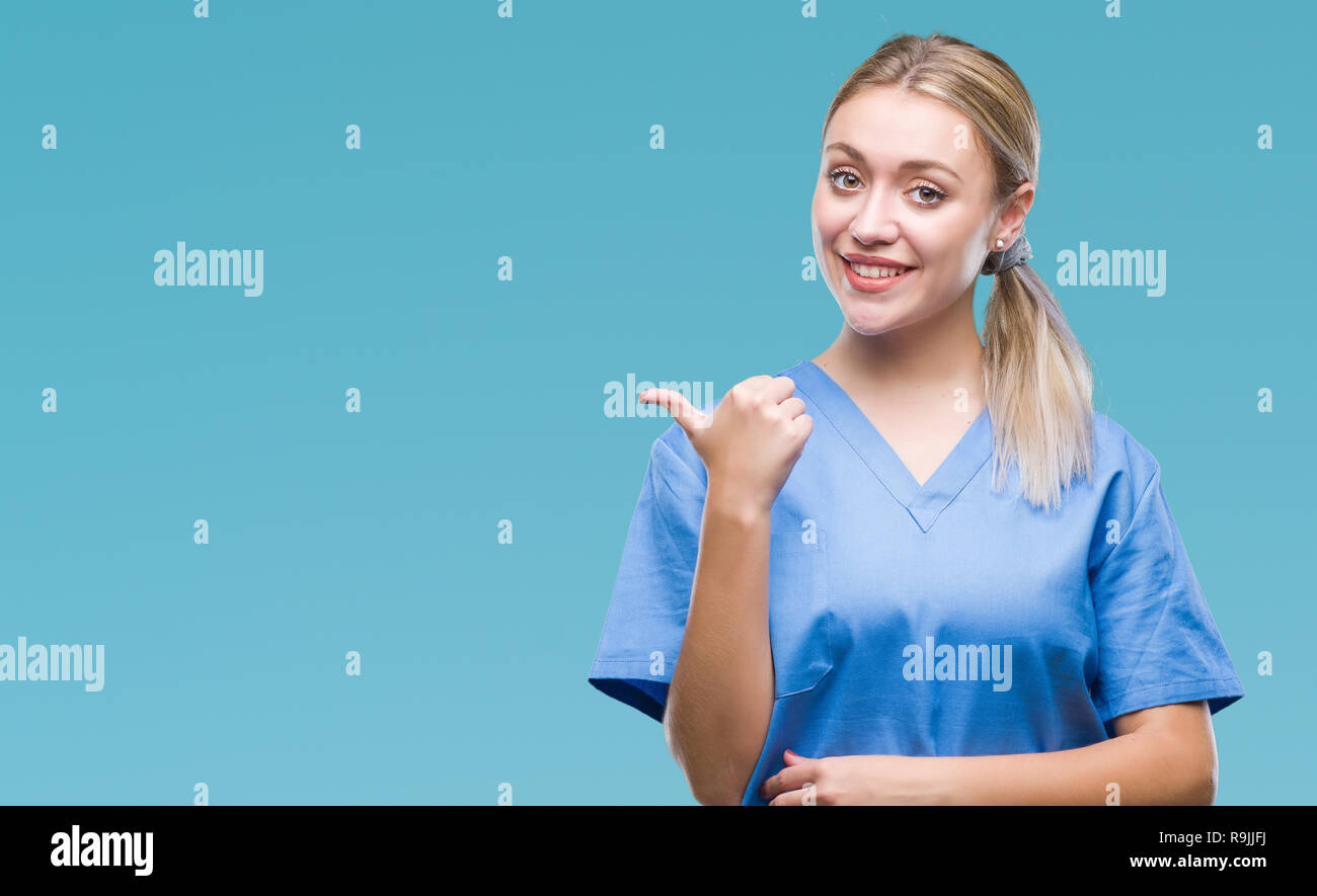 Young blonde surgeon doctor woman wearing medical uniform over isolated ...