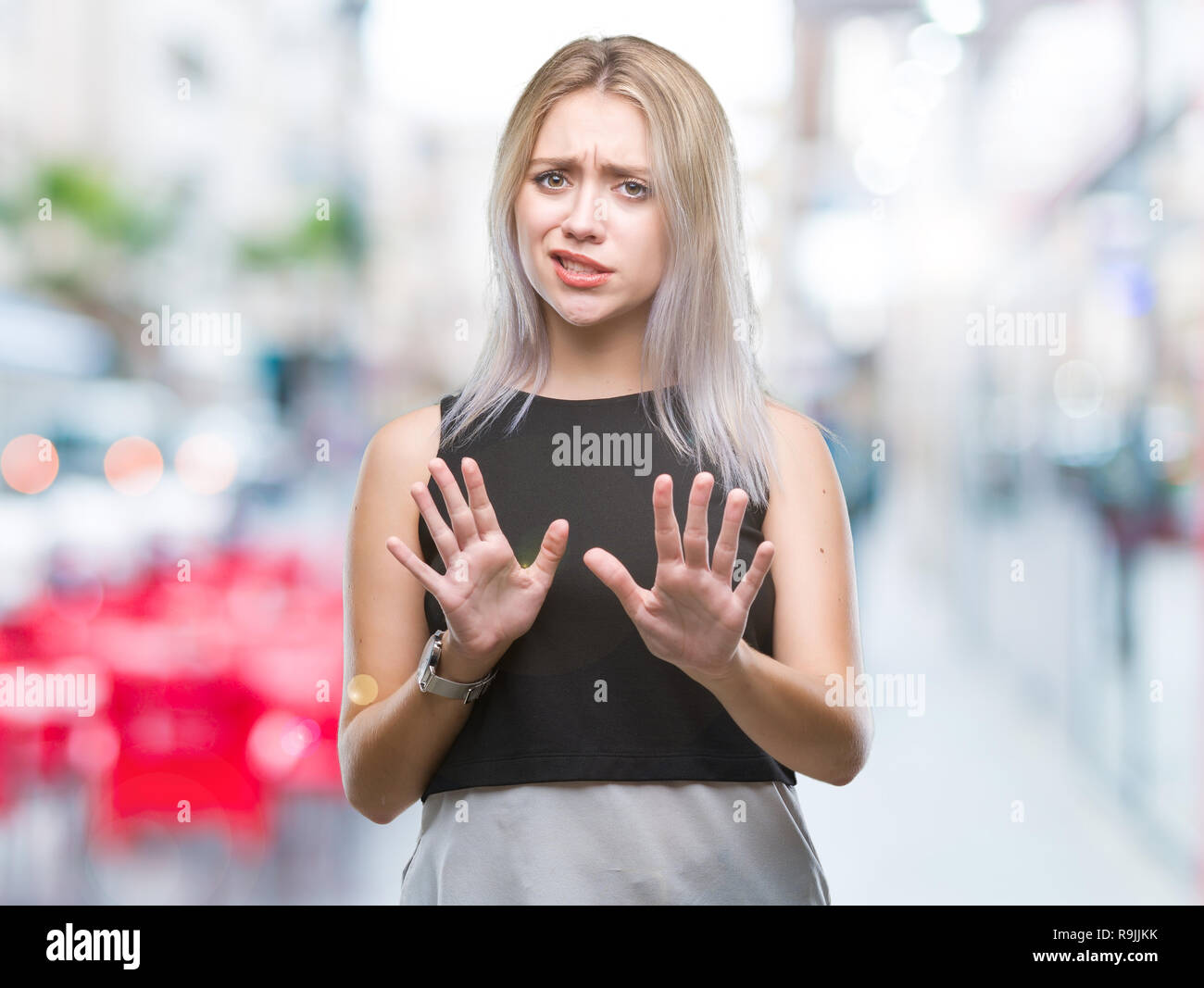 Young blonde woman over isolated background disgusted expression ...