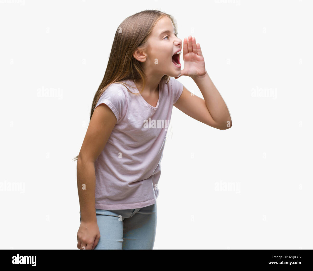 Young beautiful girl over isolated background shouting and screaming ...