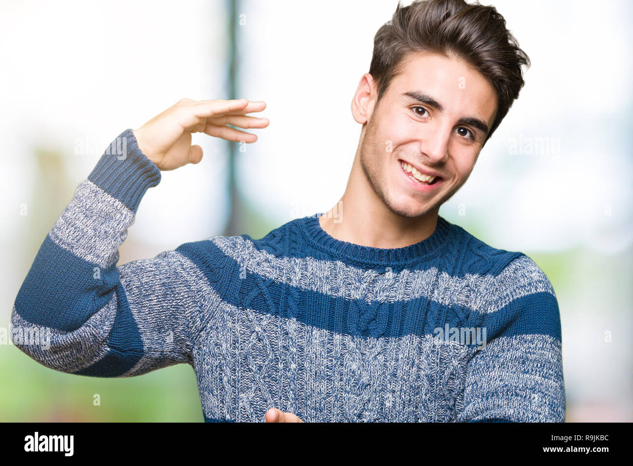 Young handsome man over isolated background gesturing with hands ...