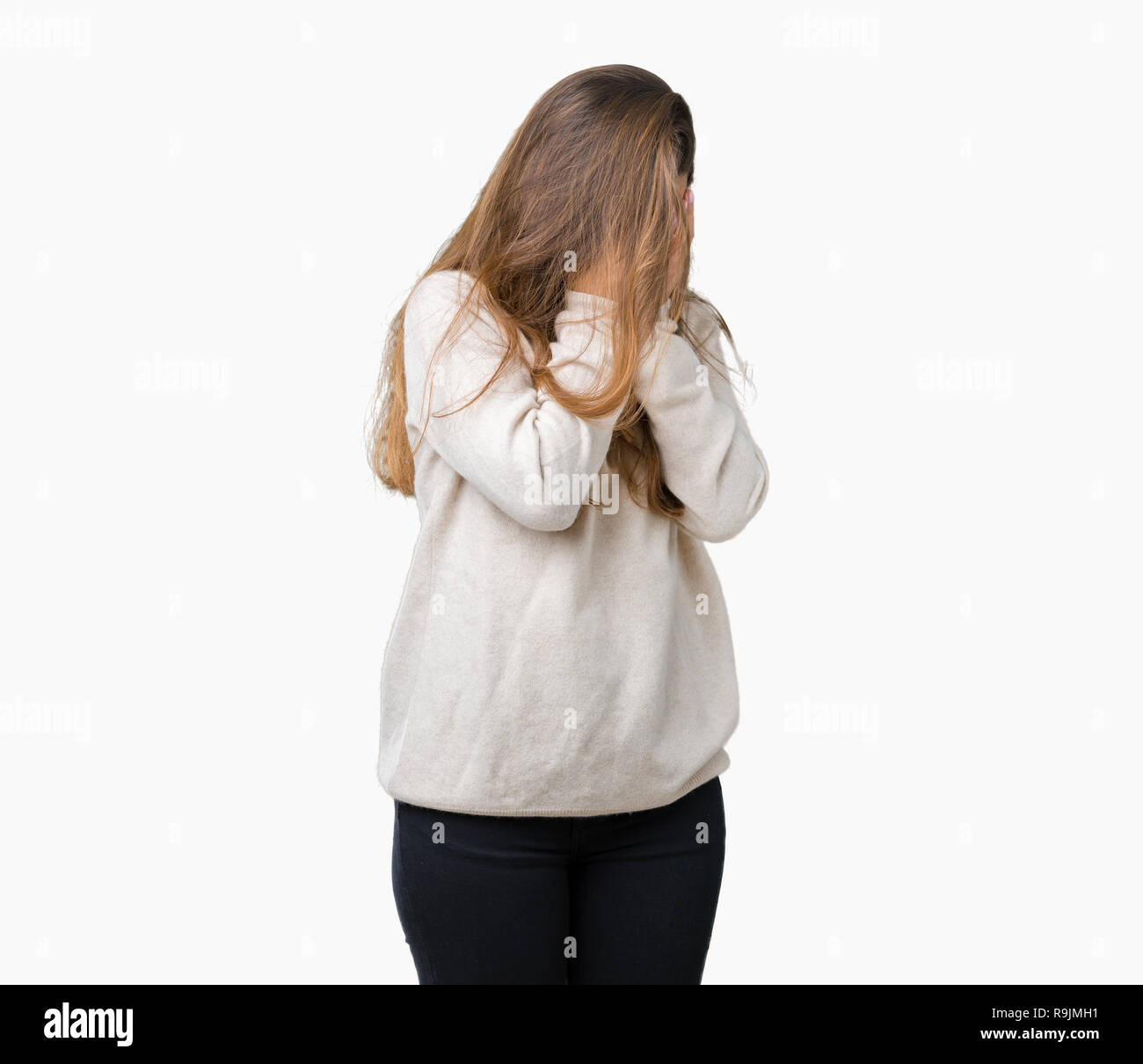 Young beautiful brunette woman wearing turtleneck sweater over isolated ...