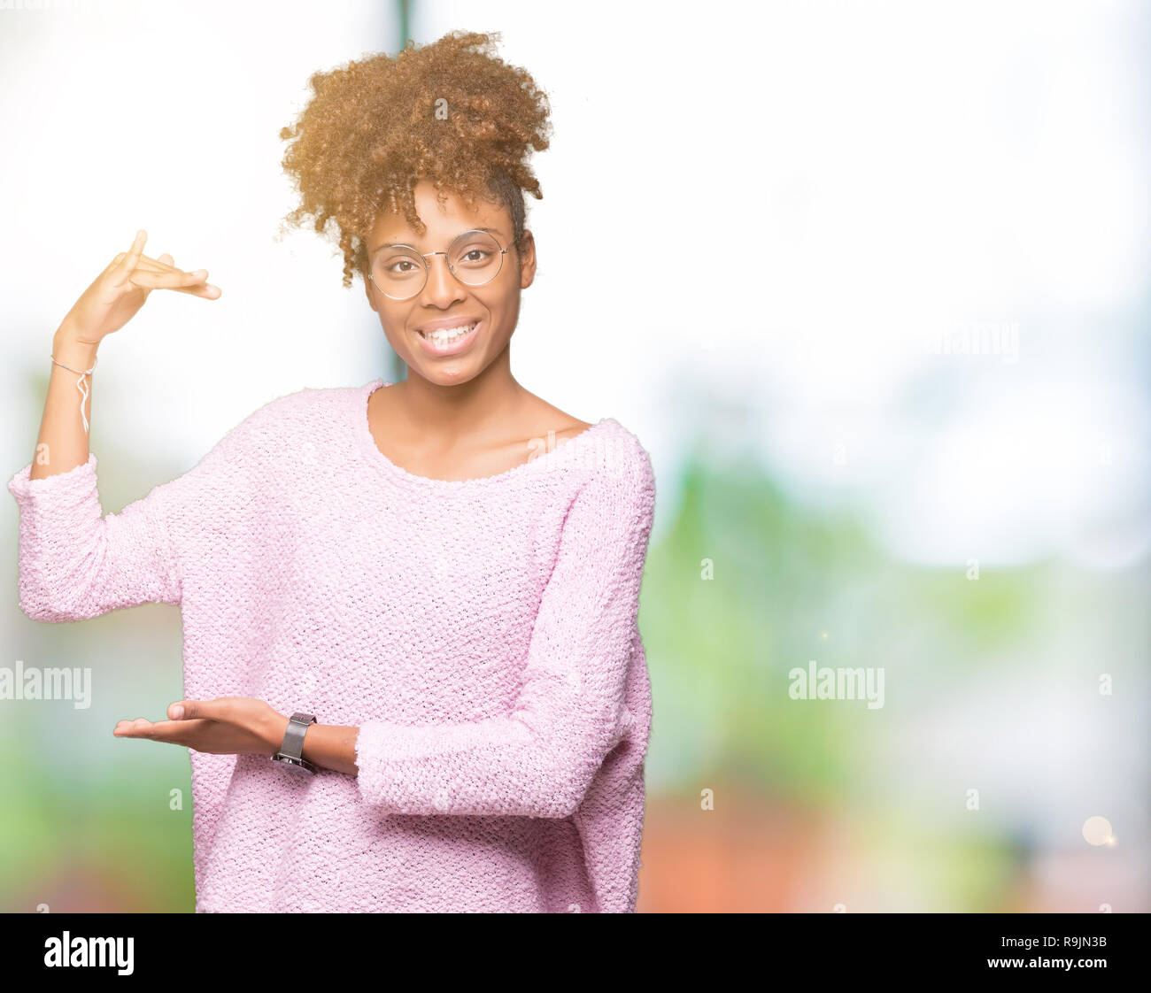 Beautiful young african american woman wearing glasses over isolated ...