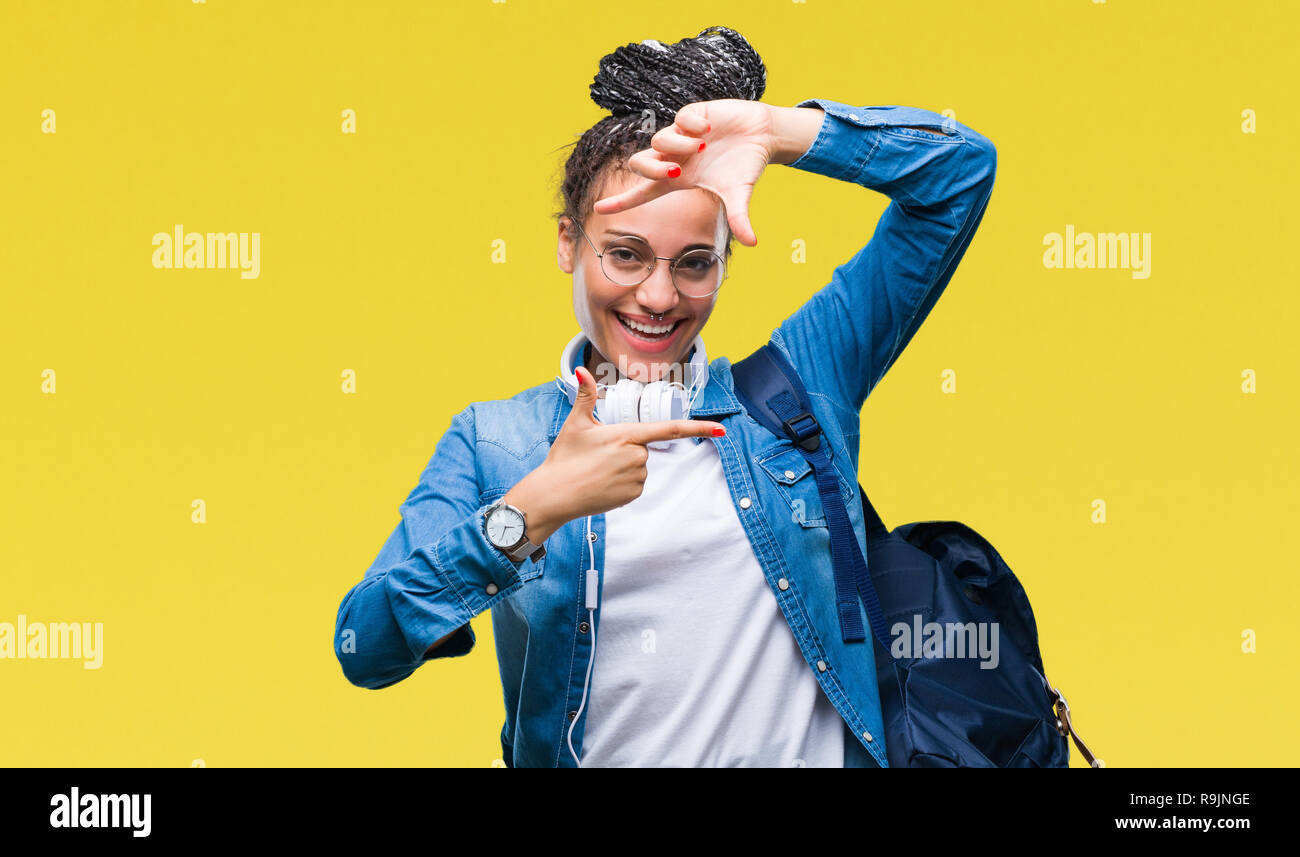 Young braided hair african american student girl wearing backpack over ...