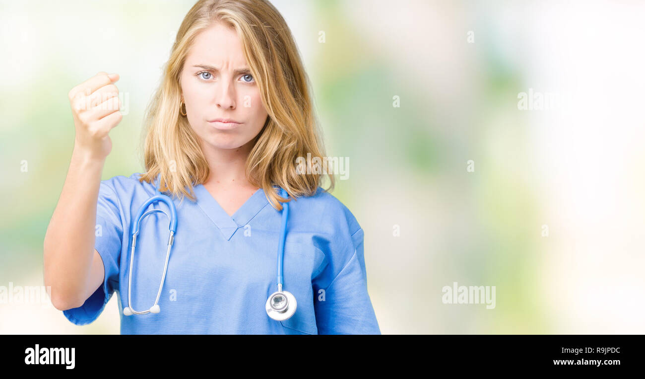 Beautiful young doctor woman wearing medical uniform over isolated ...