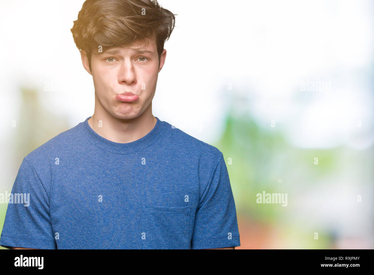 Sad man wearing blue shirt hi-res stock photography and images - Alamy