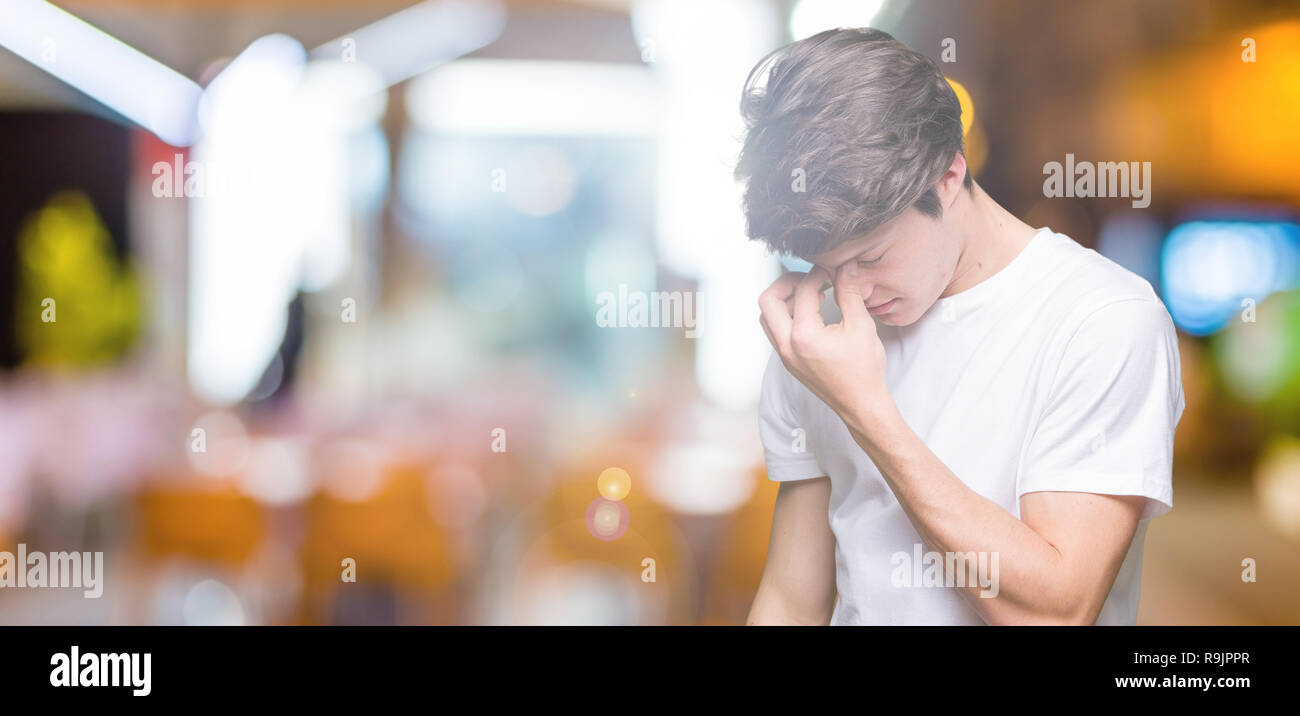 Young handsome man wearing casual white t-shirt over isolated ...