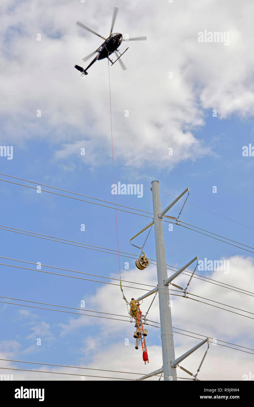 Electrical Tower Workers Stock Photo - Alamy
