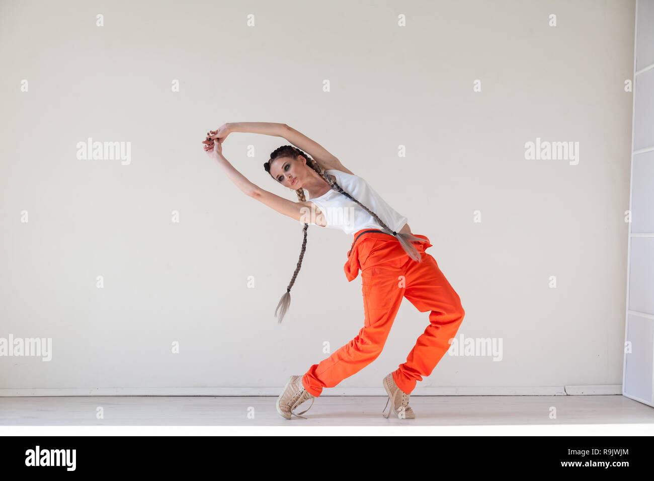 woman with braids dancing to the music Stock Photo - Alamy