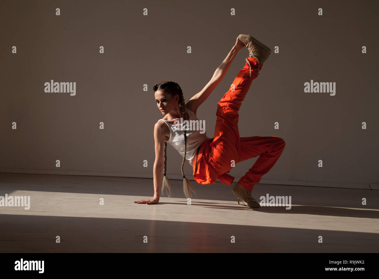 woman with braids dancing to the music Stock Photo - Alamy