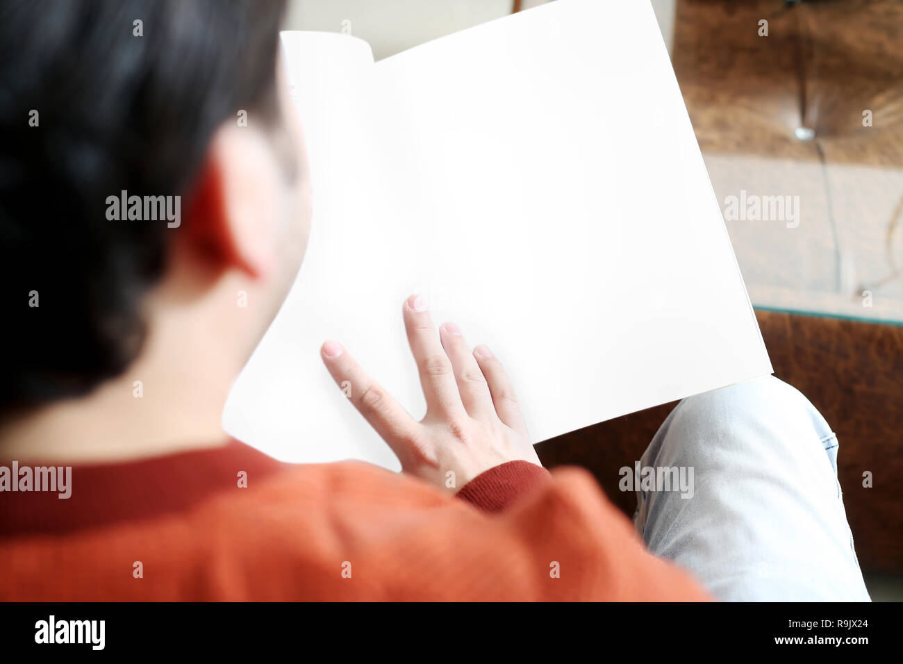 Picture of boy reading notebook Stock Photo - Alamy