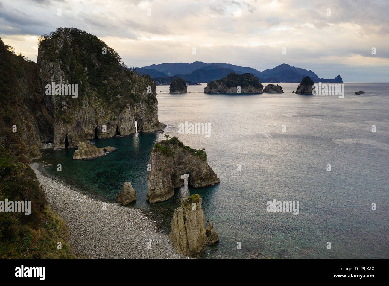 Aerial view of scenic rock formations at Futo beach, taken by a drone ...