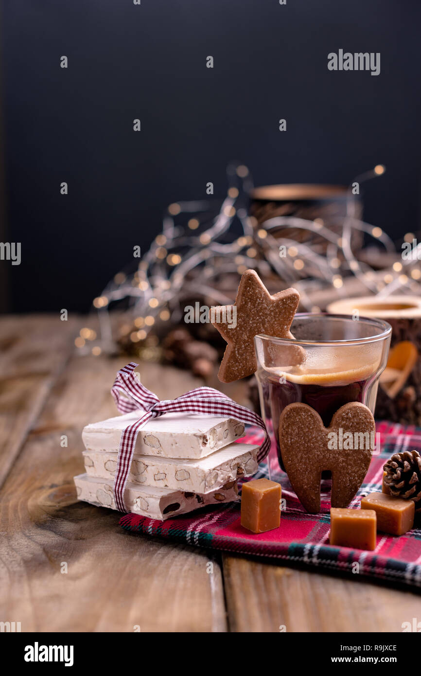 Fresh aromatic coffee and Italian Christmas sweets. Nougat with almonds ...