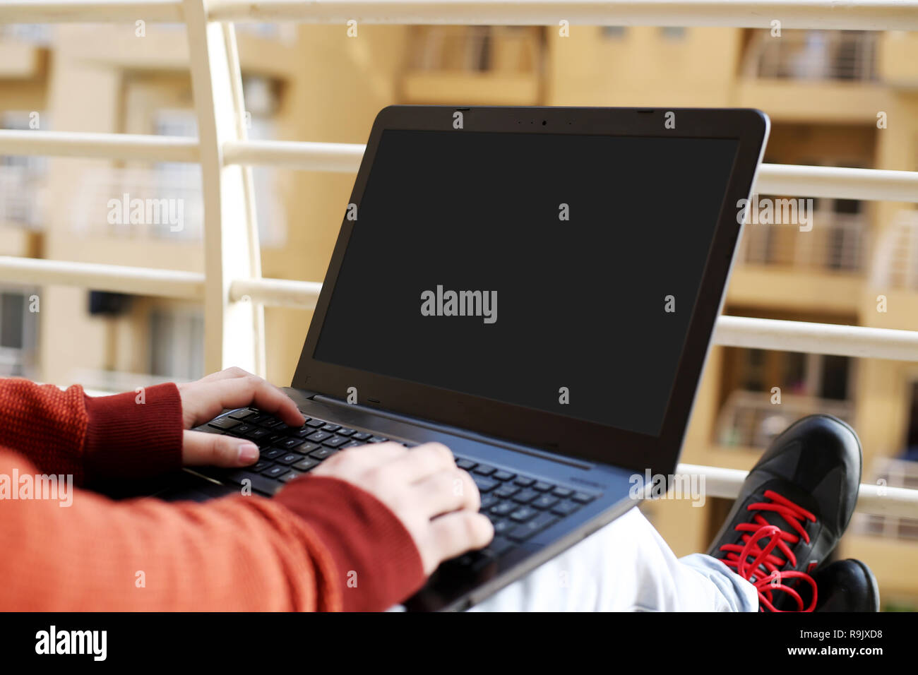 Boy is working on the laptop Stock Photo - Alamy