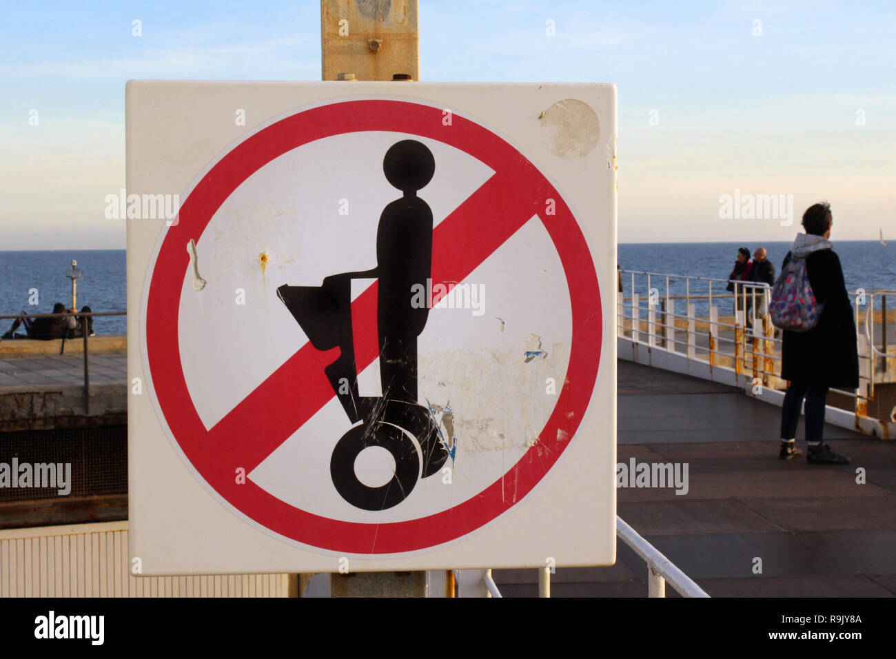 Sign forbidden segway and electric scooter with dock on background ...