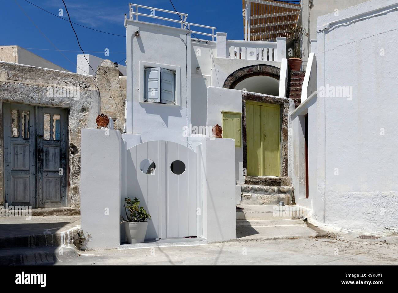 Whitewashed houses buildings in the village of Megalochori, Santorini ...