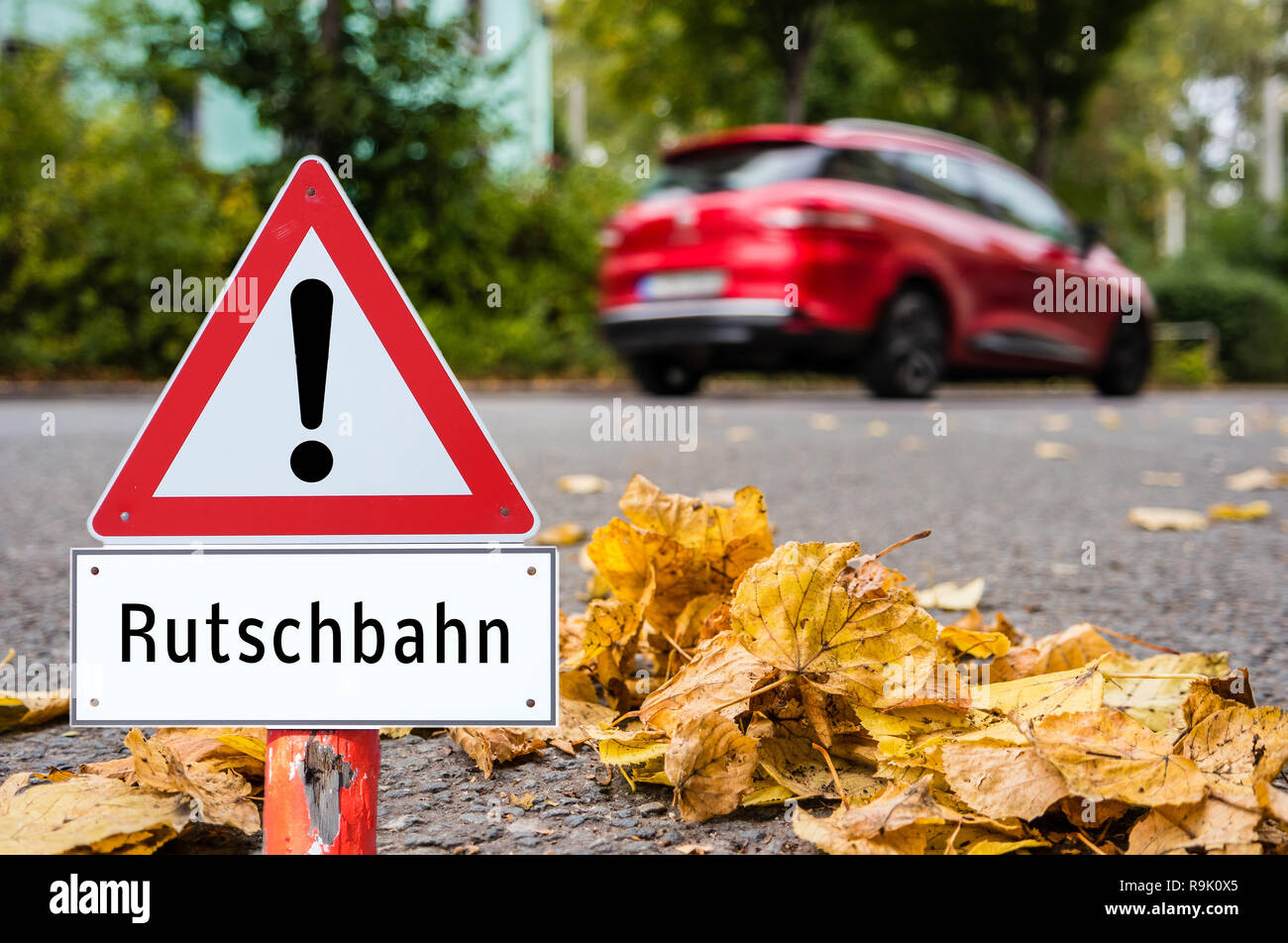 Caution slide sign Stock Photo - Alamy