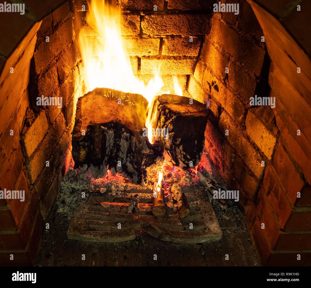 above view of burning firewood in firebox in rural house Stock Photo ...