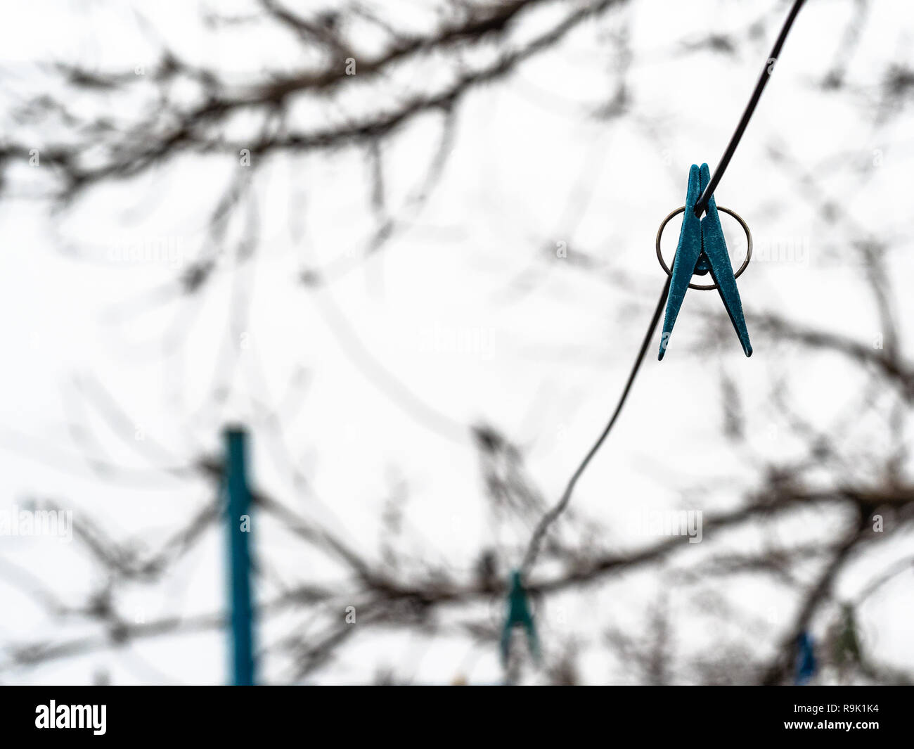 clothes pin on empty clothesline on rural backyard in winter evening ...