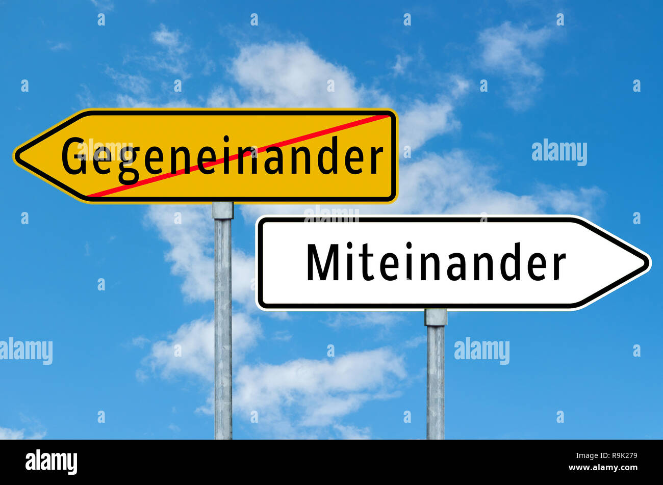 Signposts Against each other and togetherness Stock Photo - Alamy