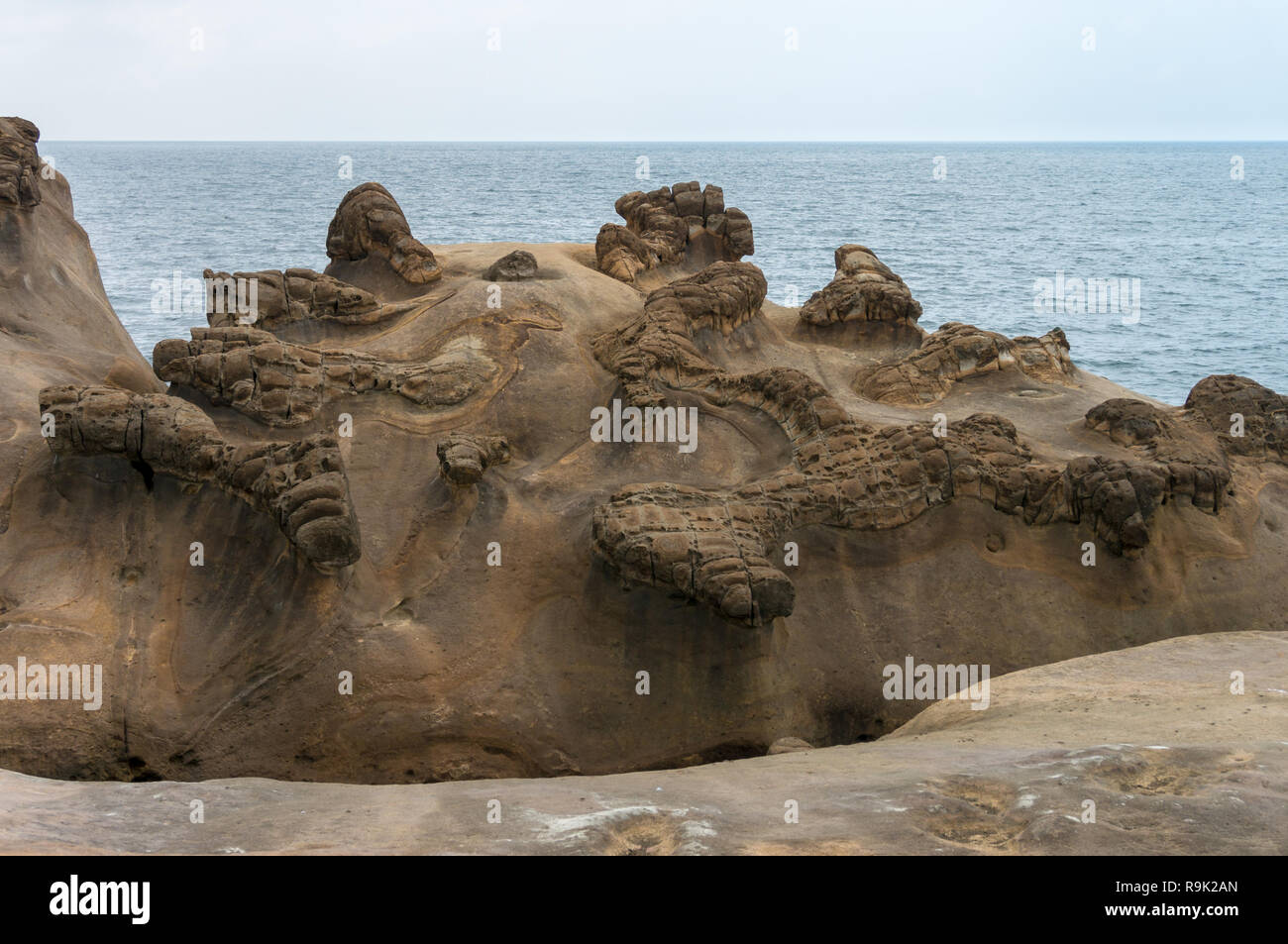 Unique geological formations at Yehliu Geopark in Taiwan on a sunny day ...