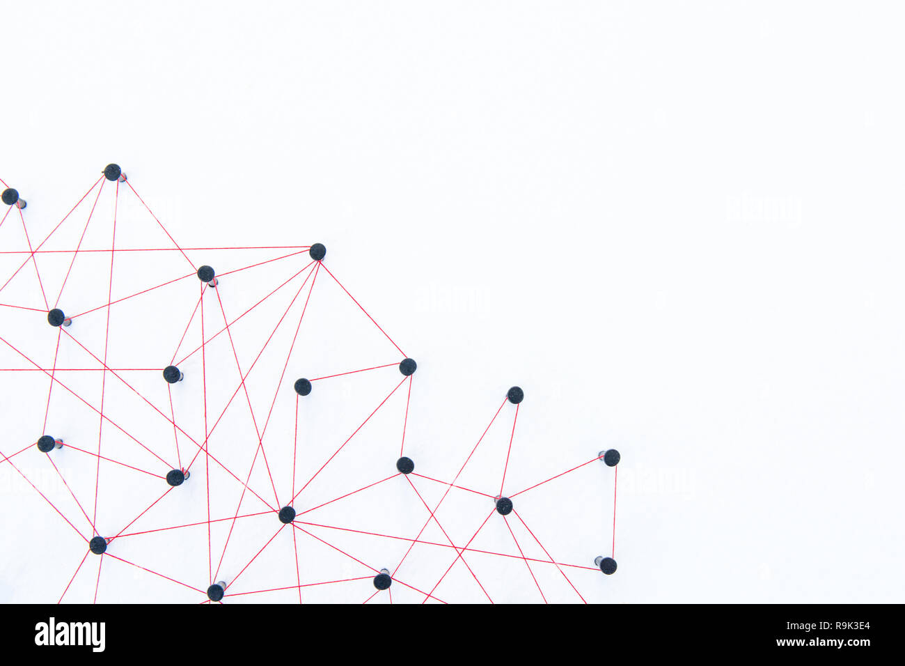 Connecting networks concept - network connected with yarn red on white ...